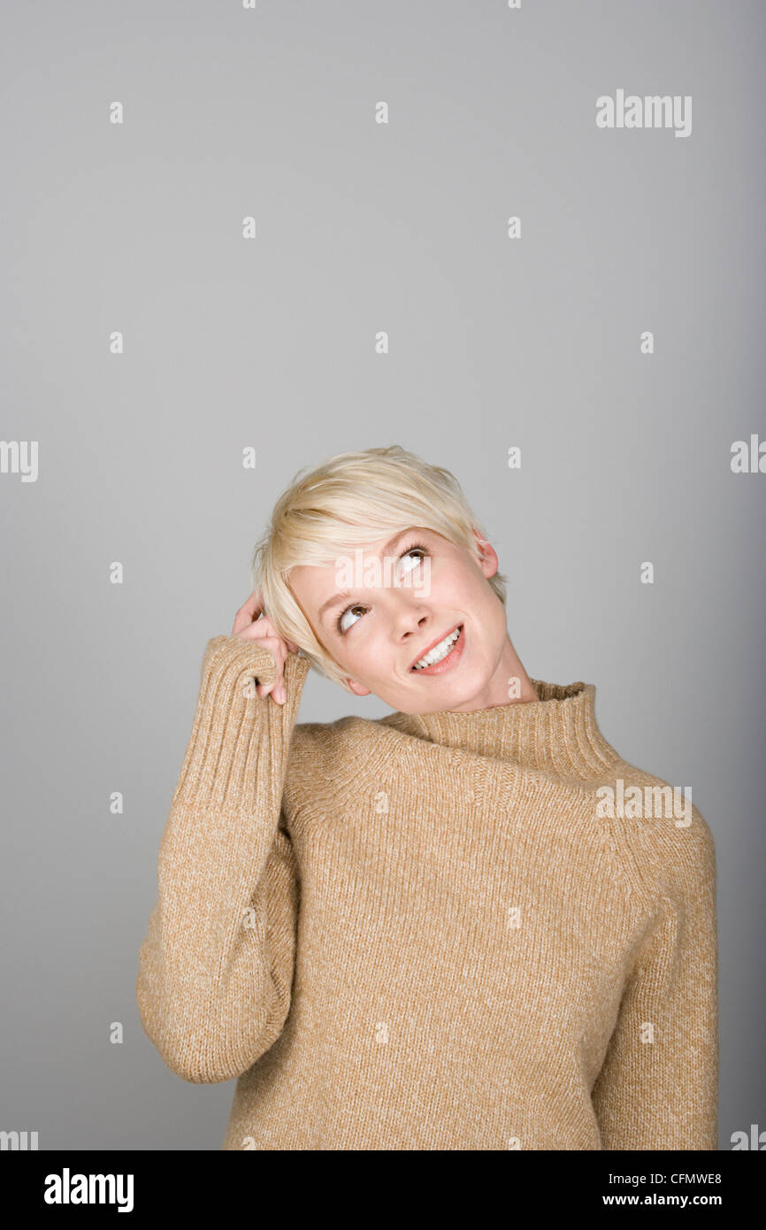 Woman scratching head hi-res stock photography and images - Alamy