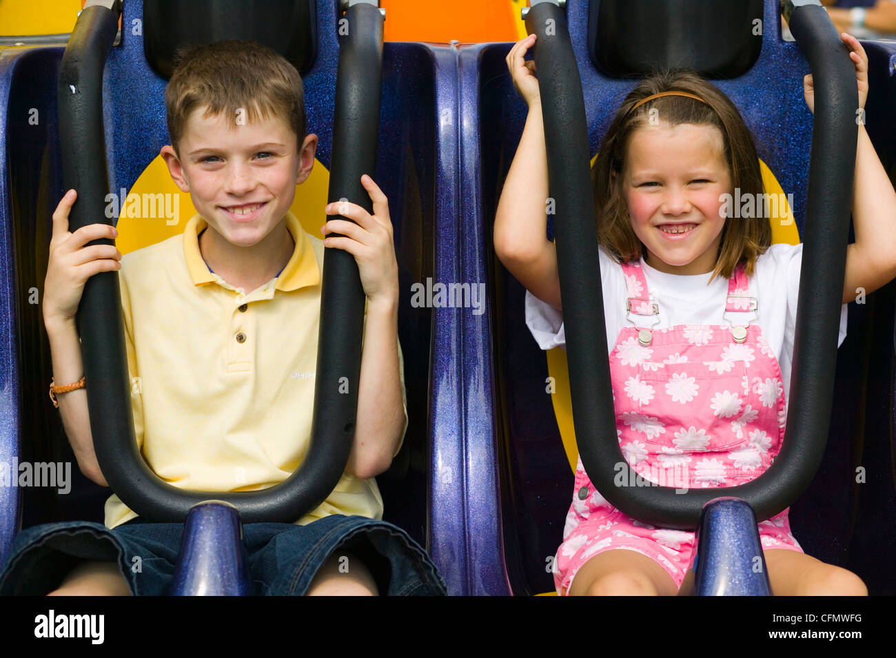 Brother and Sister on Ride at Amusement Park Stock Photo - Alamy