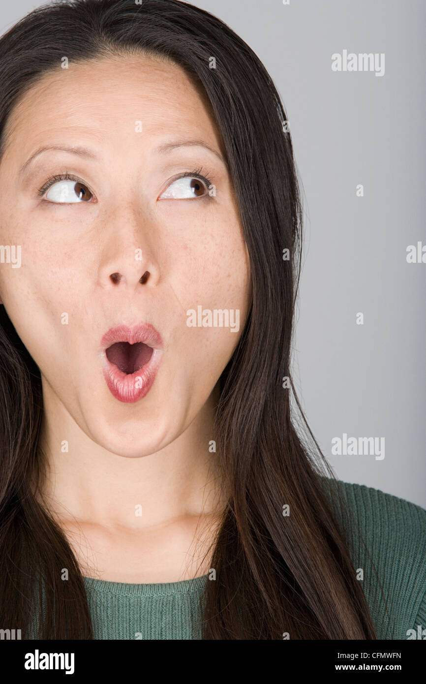 Studio shot portrait of mid adult woman with mouth open Stock Photo - Alamy