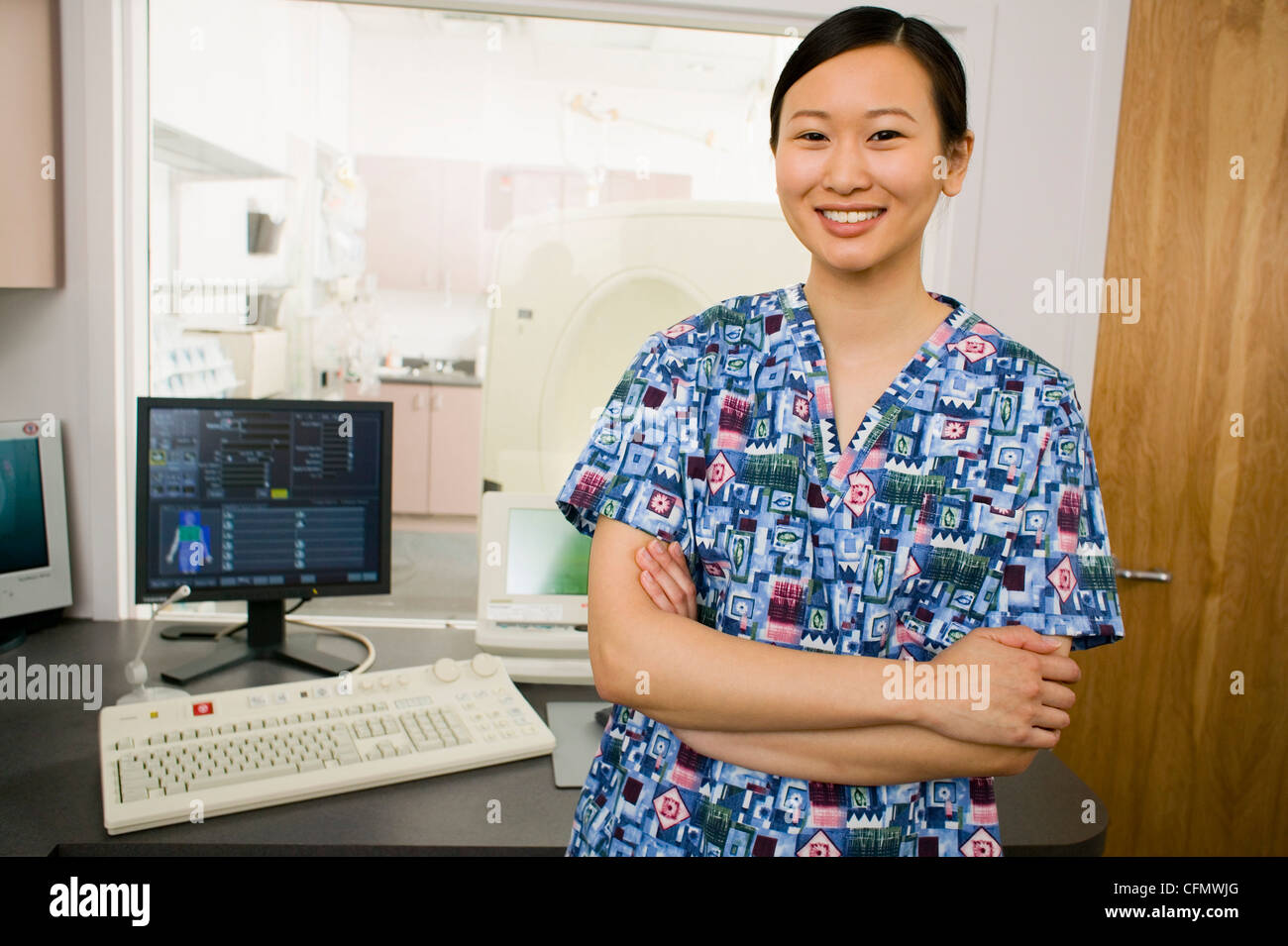 Technologist in Control Room of CT Scanner Stock Photo - Alamy