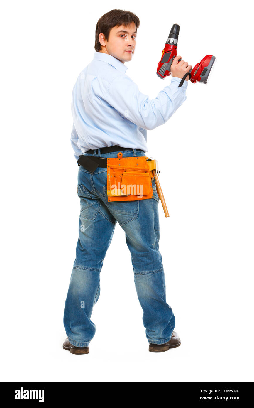 Full length portrait of construction worker with drill look back Stock ...