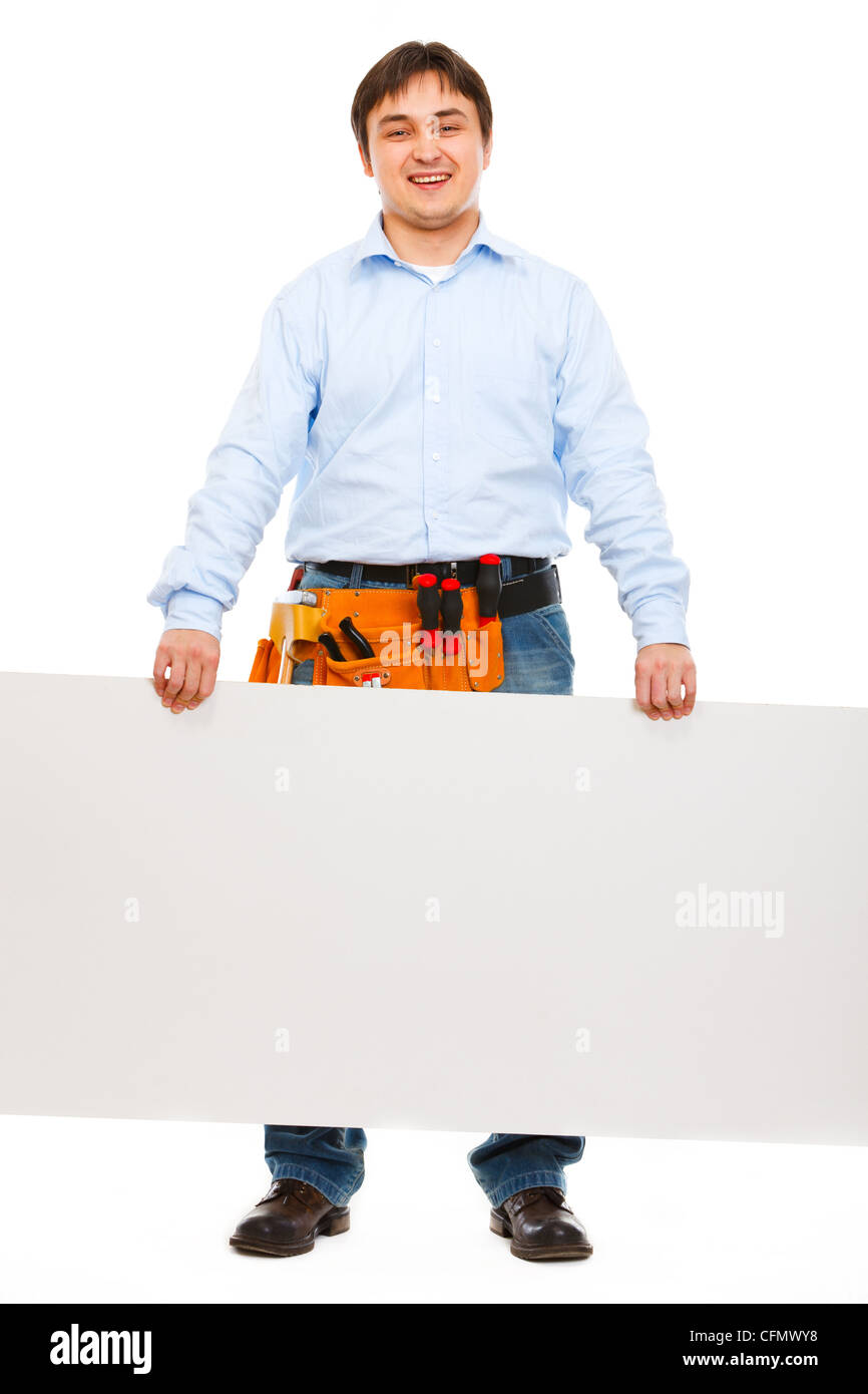 Smiling construction worker holding blank billboard Stock Photo - Alamy