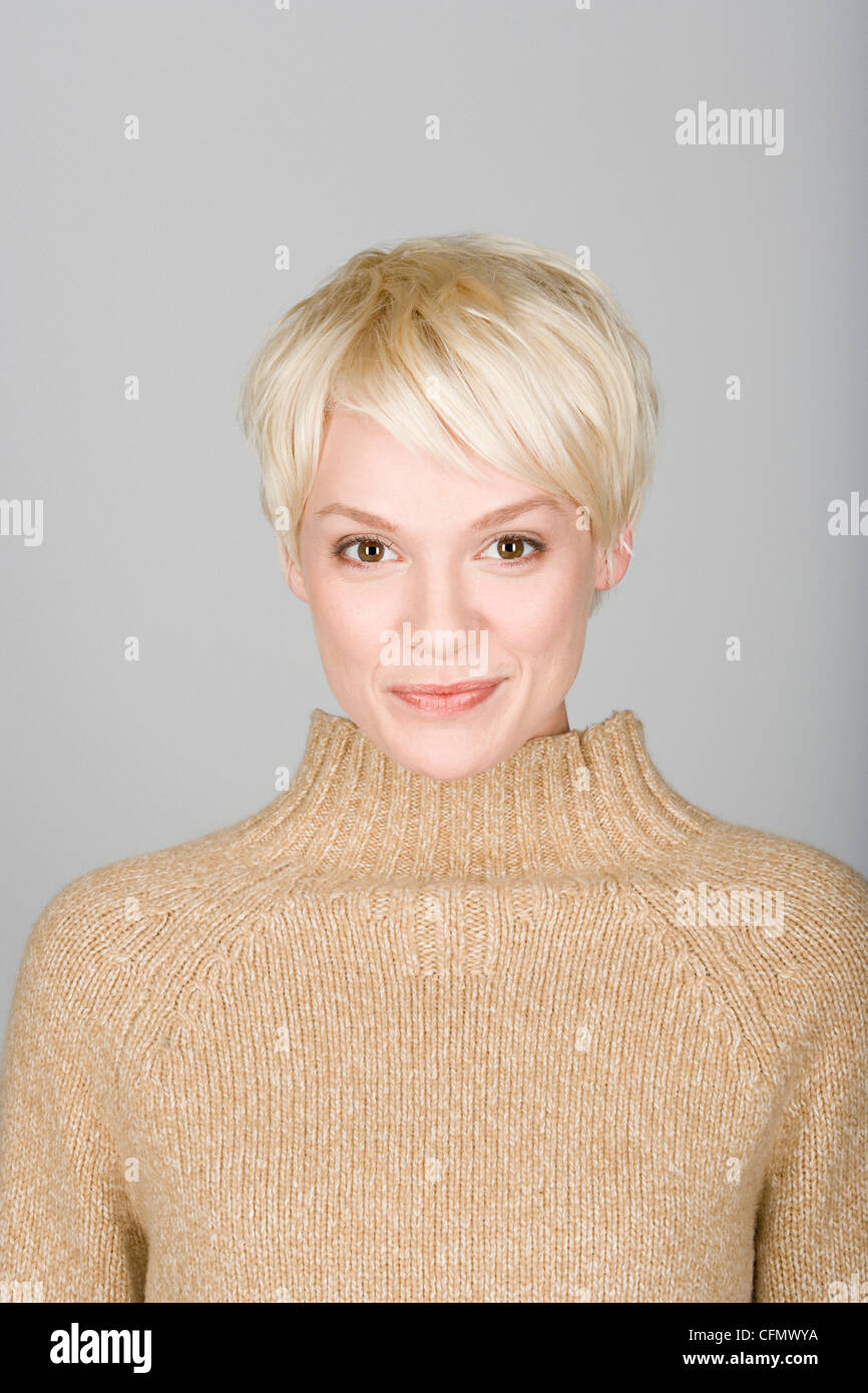 Studio shot portrait of mid adult woman, head and shoulders Stock Photo ...