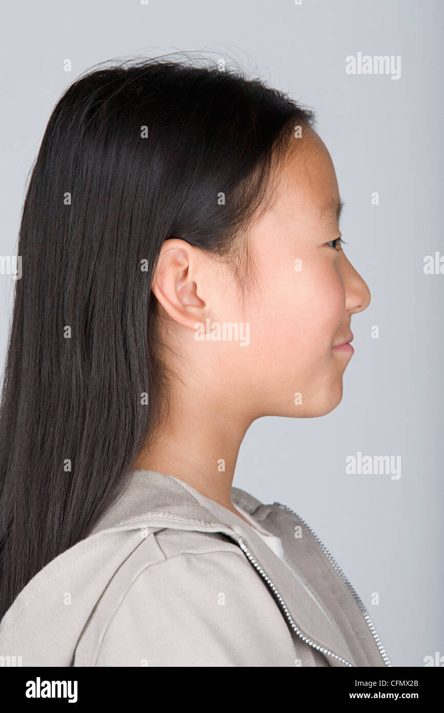 Studio portrait of happy Chinese teenage girl (16-17 Stock Photo - Alamy