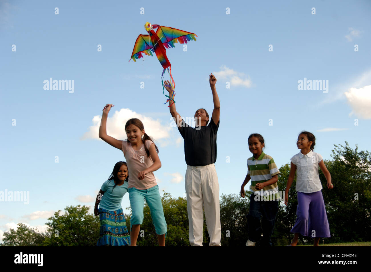 Family Flying Kite Stock Photo - Alamy