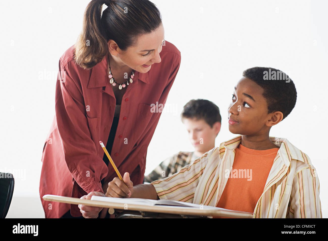 USA, California, Los Angeles, Teacher checking boys homework Stock ...