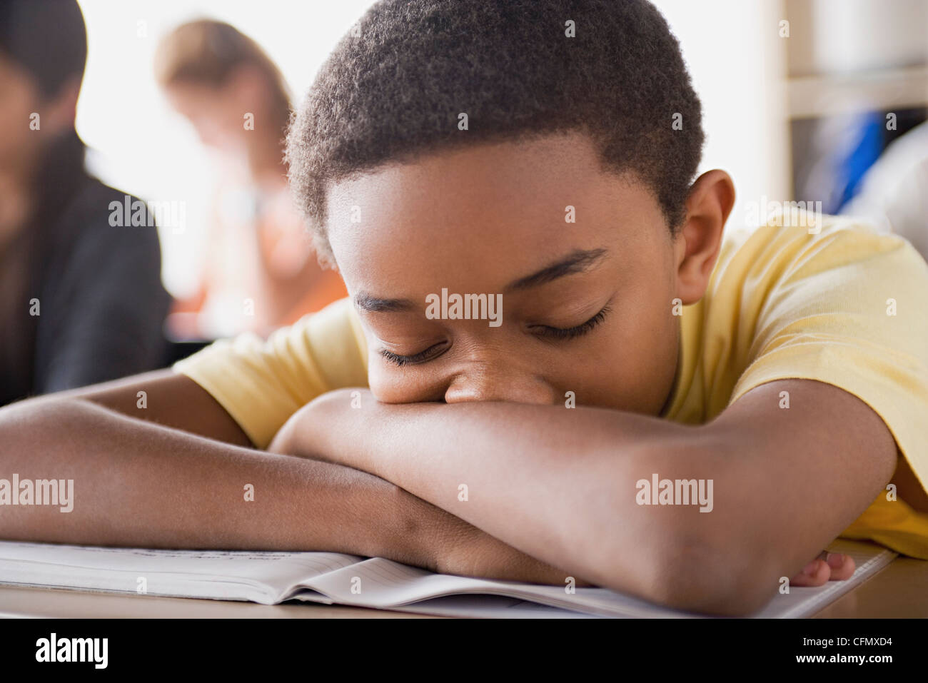 Sleeping kids on desk hi-res stock photography and images - Alamy