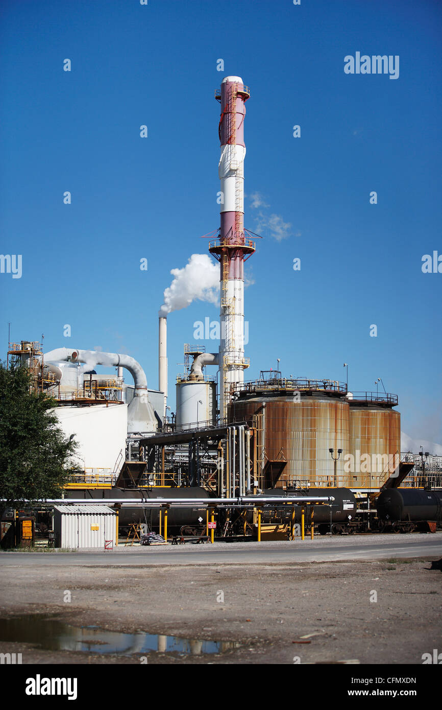 The pipe farm and a smokestack at an industrial plant at an industrial ...