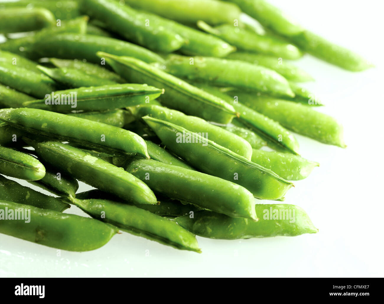 Close-up of fresh green pea pods with water drops Stock Photo - Alamy