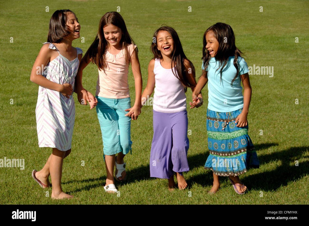 Young Girls Walking in Park Stock Photo - Alamy