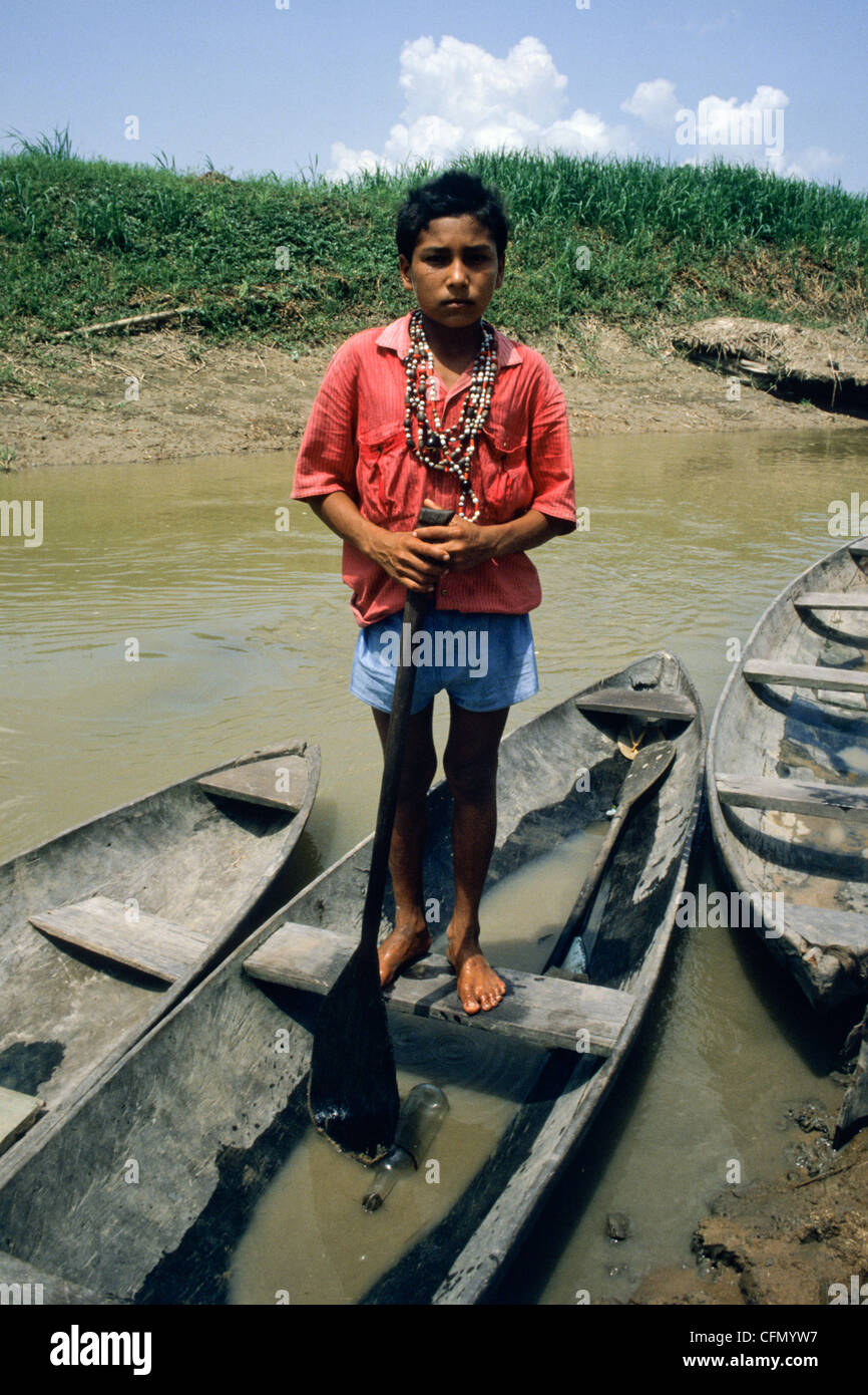 Young man in his dugout canoe near the Amazon River Brazil Stock Photo ...