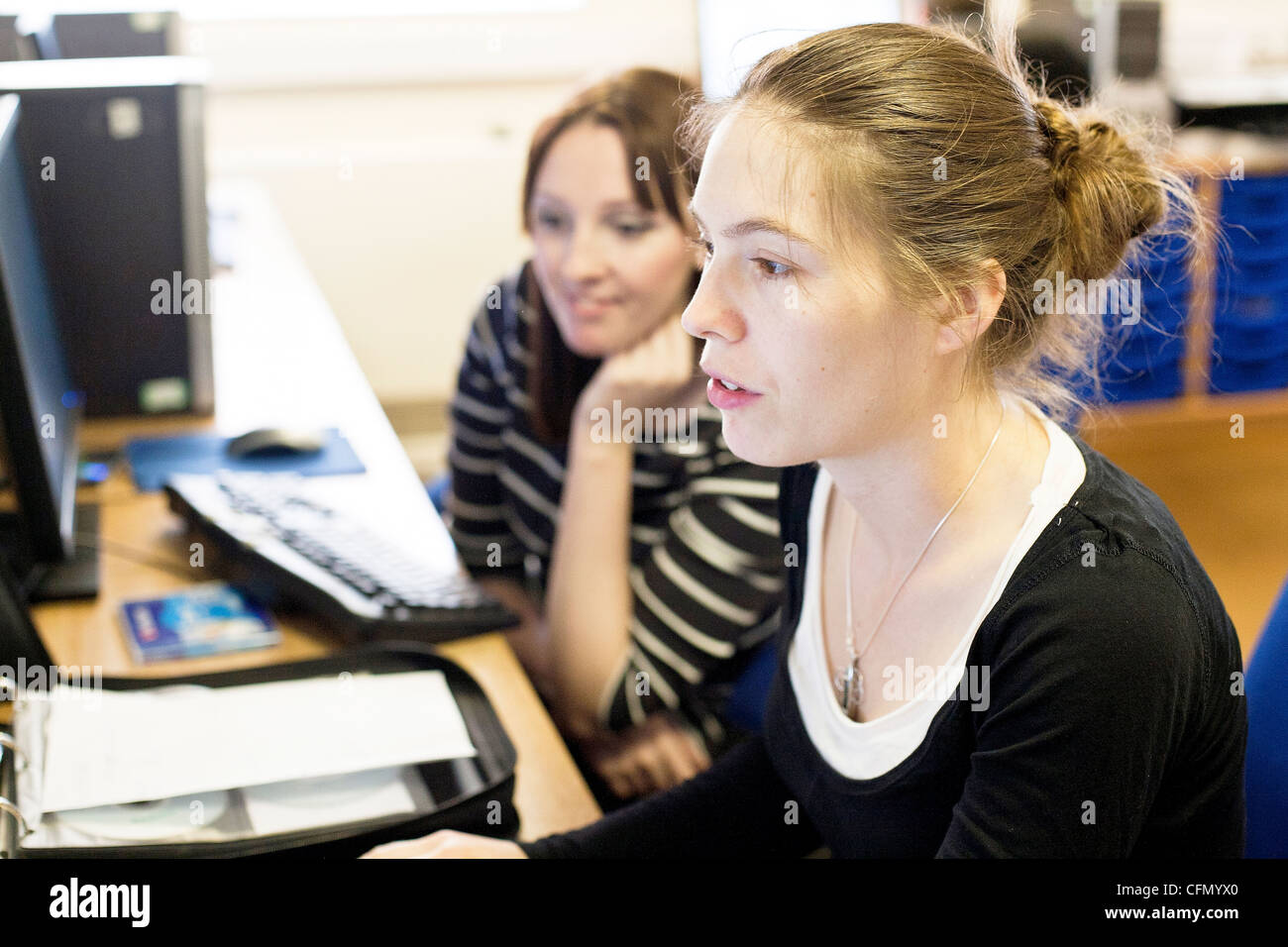 Female IT workers at their monitors Stock Photo - Alamy