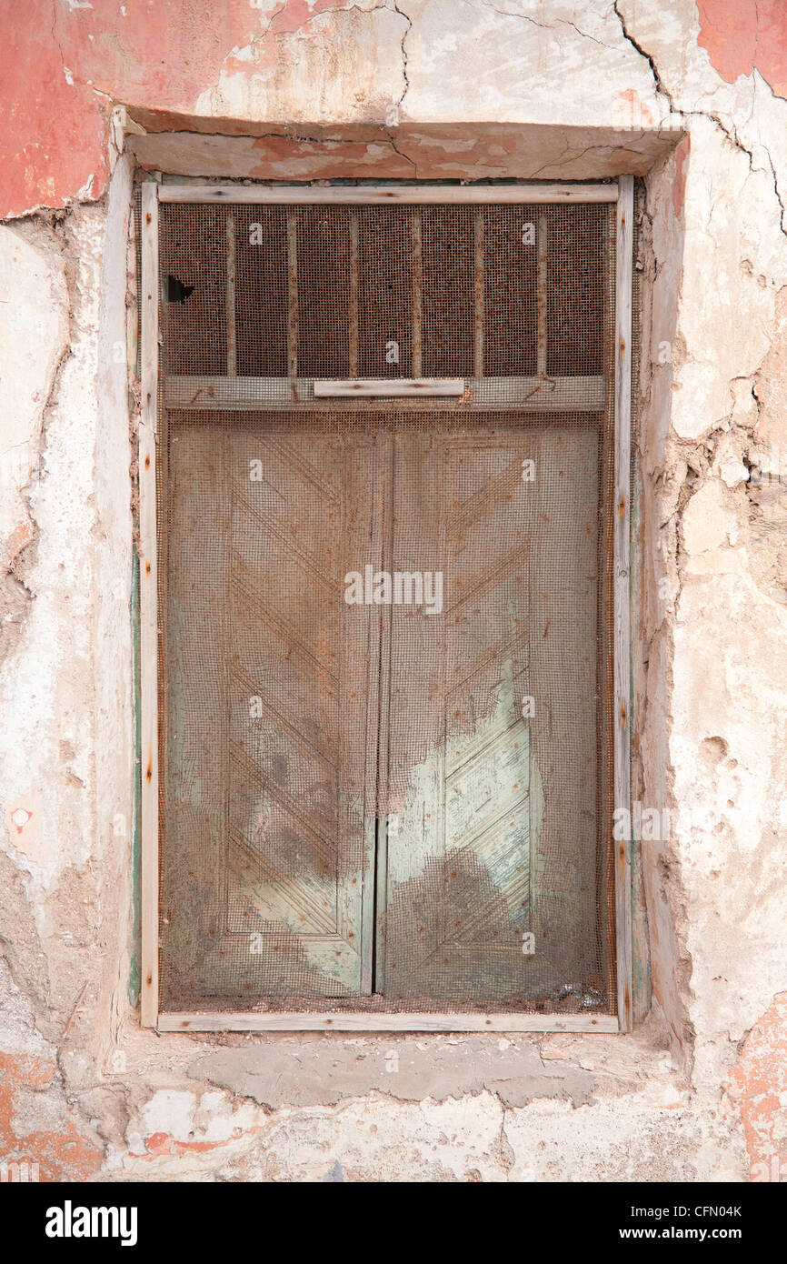 Old shuttered window with decrepit metal screen Stock Photo - Alamy