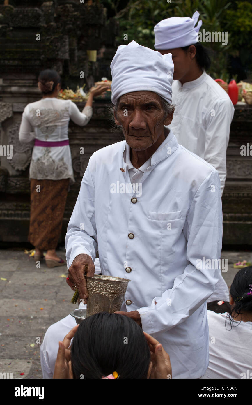 Priest in a temple at a religious ceremony in Bali, South Pacific ...