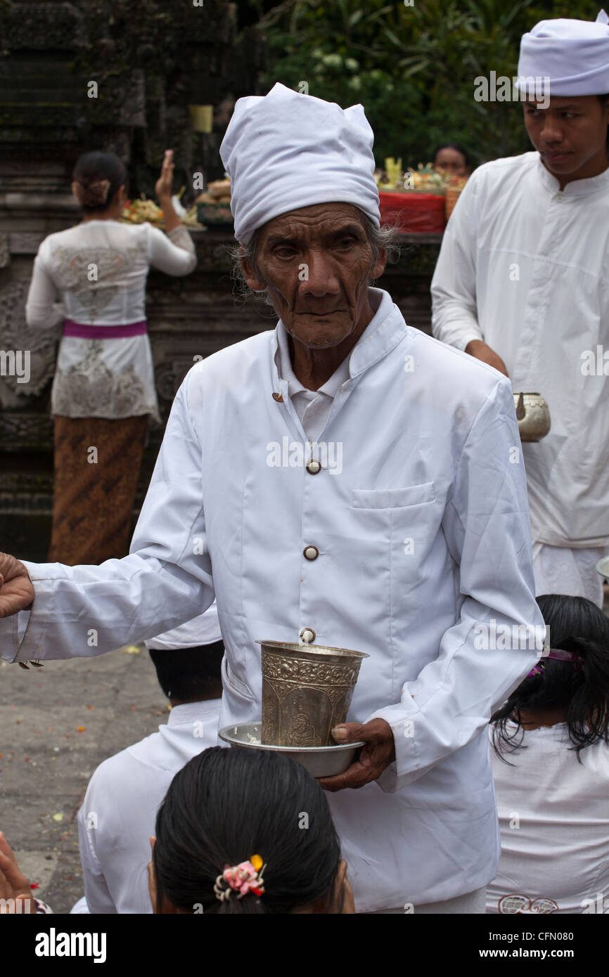 Priest in a temple at a religious ceremony in Bali, South Pacific ...