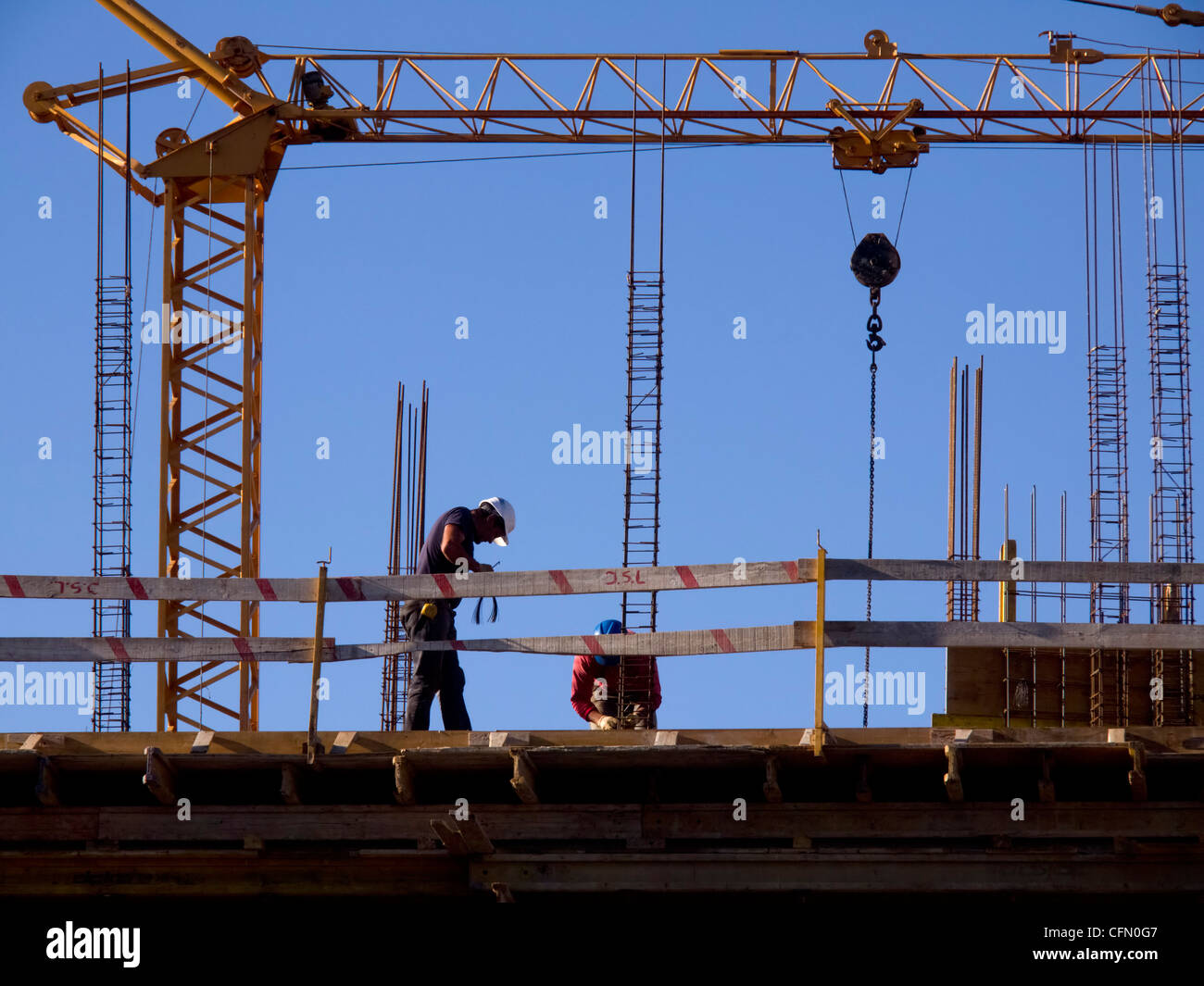 Construction workers at a construction site Stock Photo - Alamy