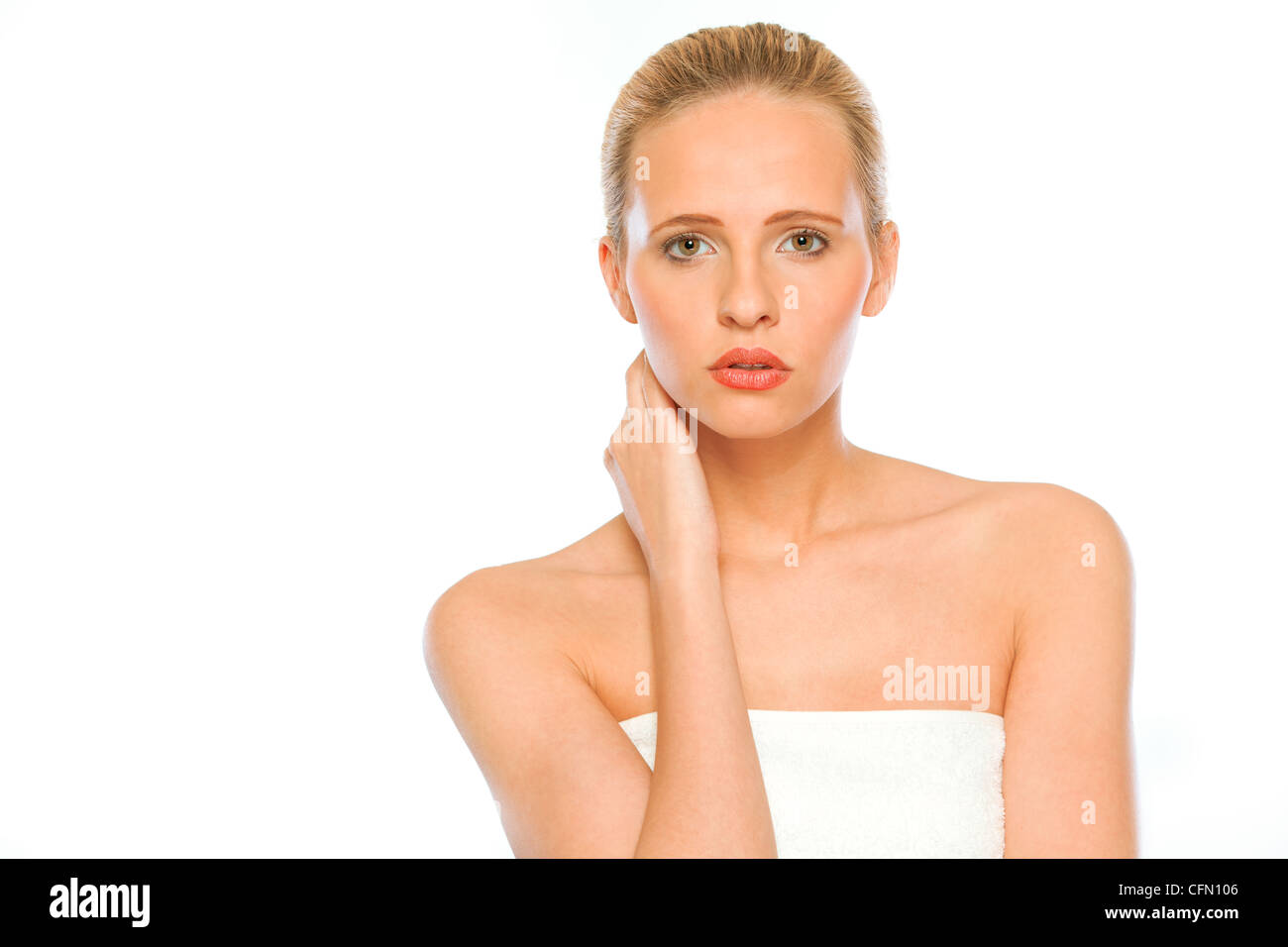 Young fresh woman holding hand near neck isolated on white Stock Photo ...