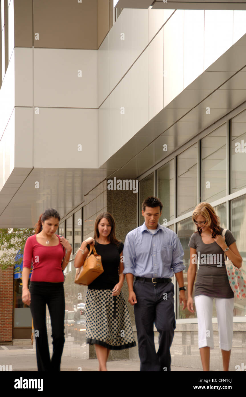 Friends Walking on Sidewalk Stock Photo - Alamy