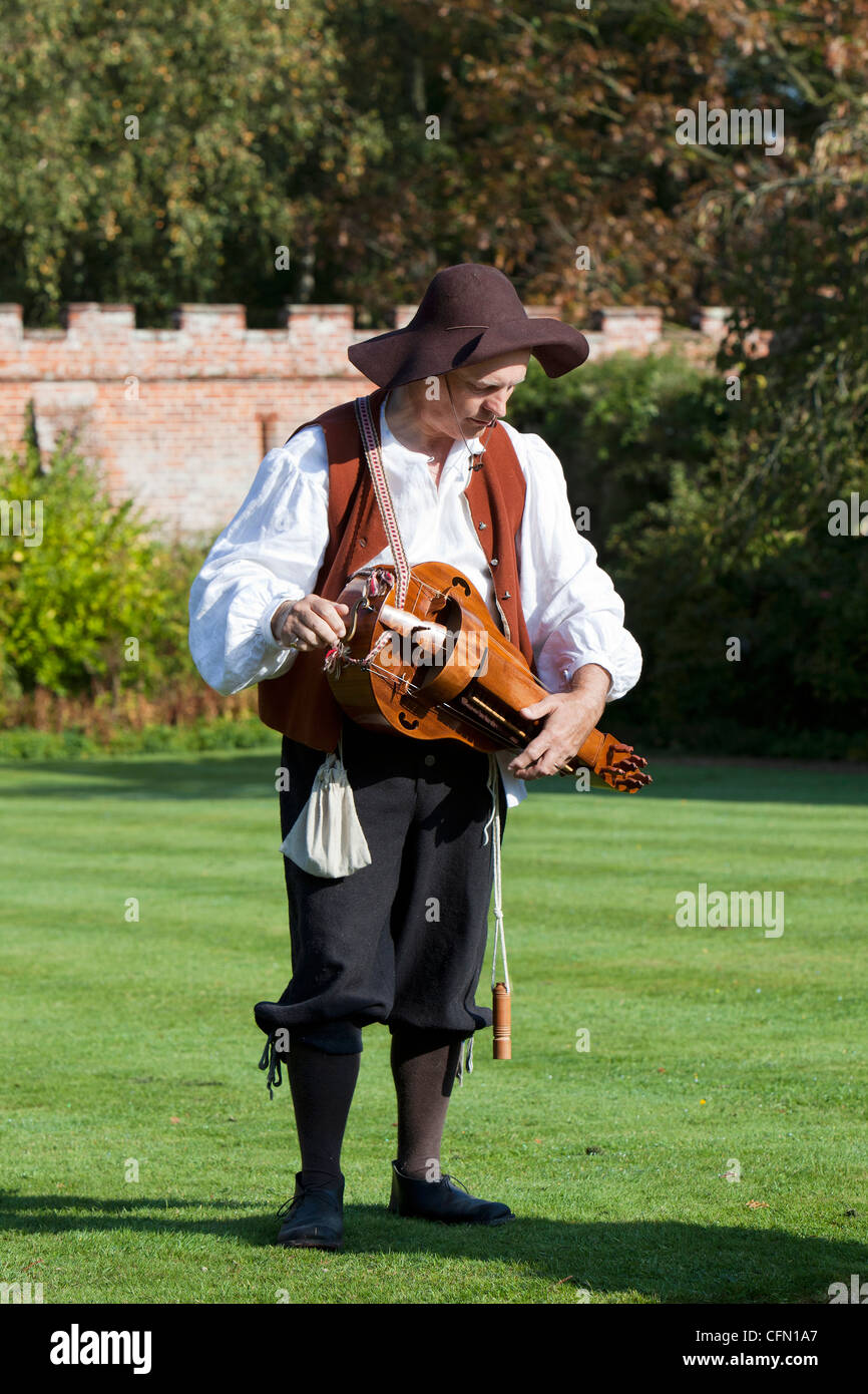 Late15th early 16th century Hurdy gurdy (fiddle with a wheel) being ...