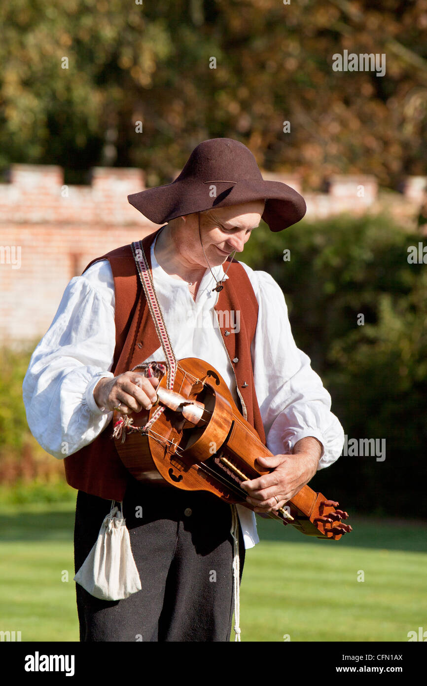 Late15th early 16th century Hurdy gurdy (fiddle with a wheel) being ...