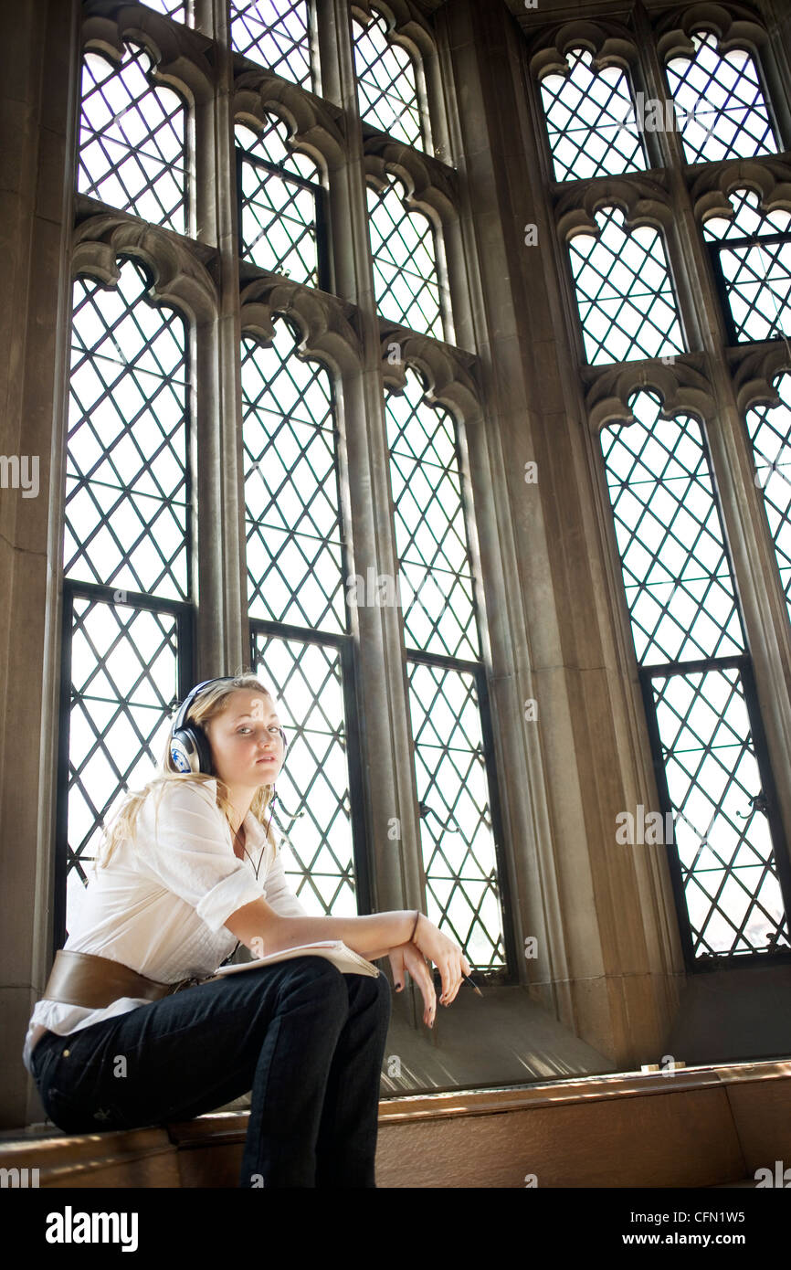 Student on Window Seat Listening to Music Stock Photo - Alamy
