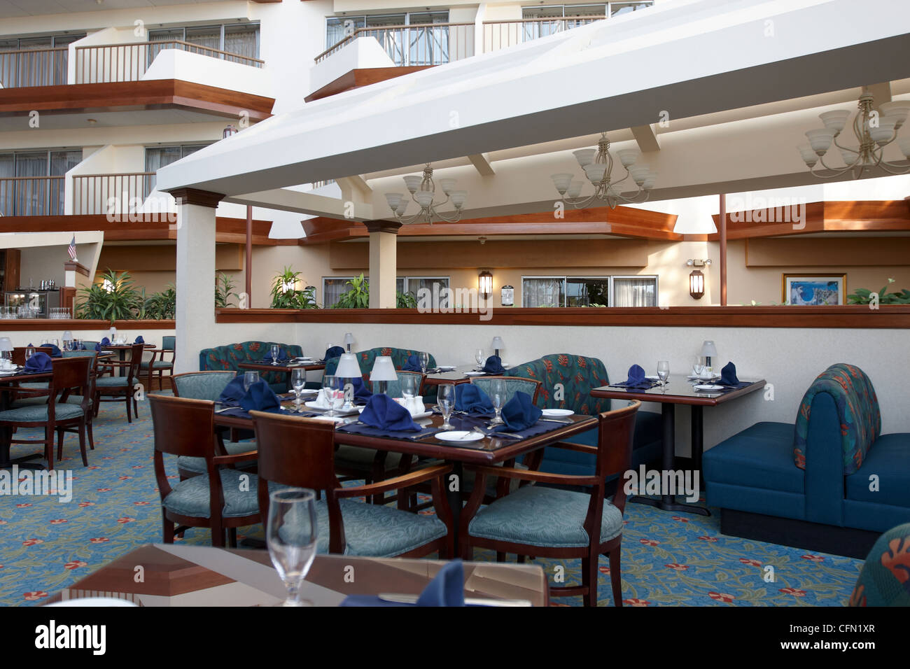 A restaurant in a an open space with tables set for lunch Stock Photo ...