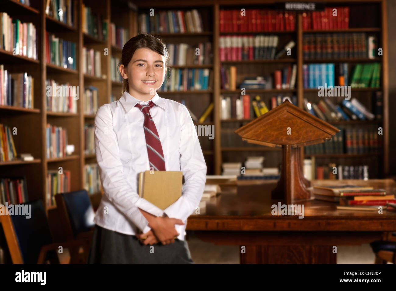 Female Student in Library Stock Photo - Alamy