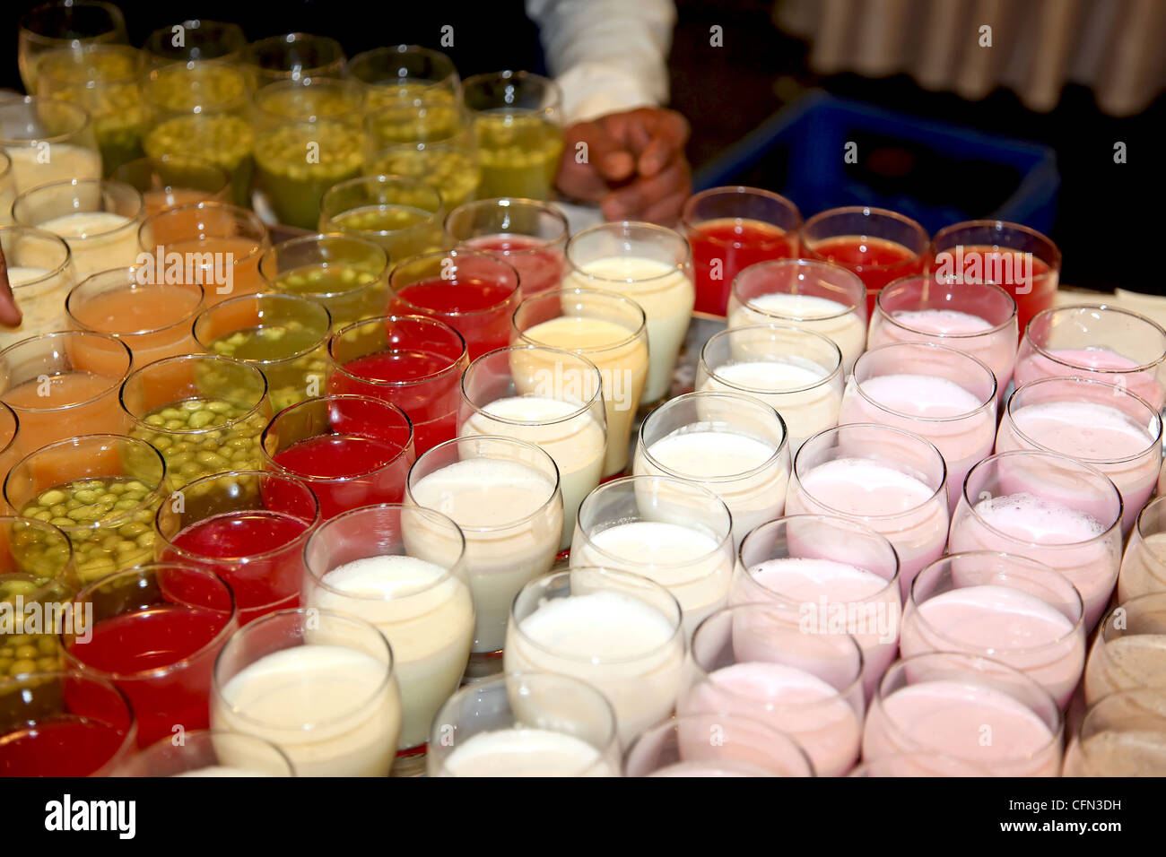 Fresh fruit juice and cold drink serving in the party Stock Photo - Alamy