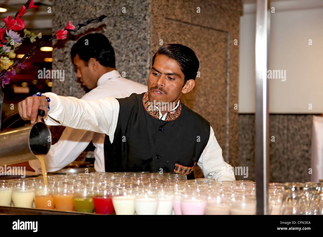 Waiter at the Counter Stock Photo - Alamy