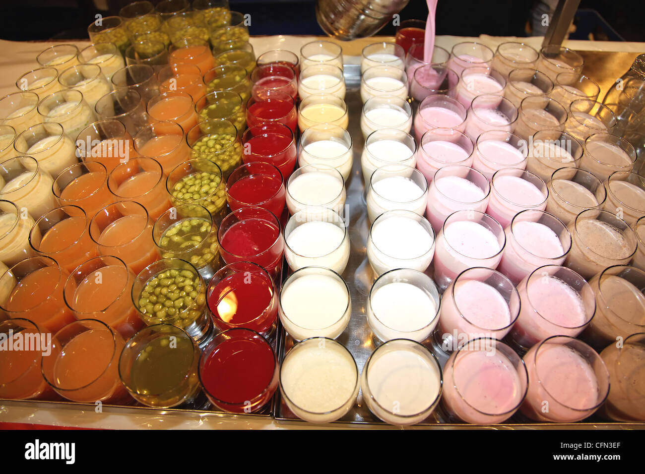 Fresh fruit juice and cold drink serving in the party Stock Photo - Alamy