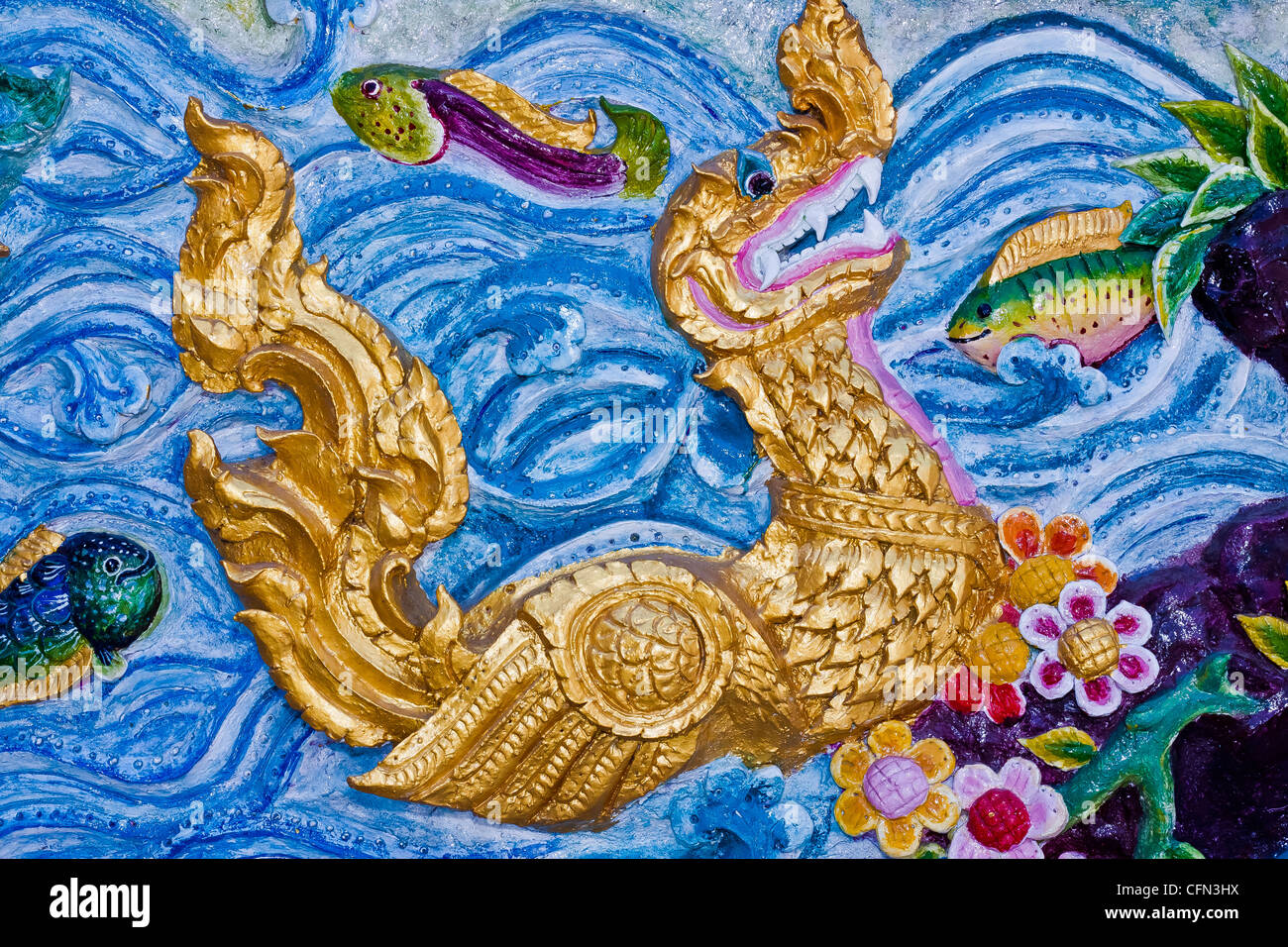 Native art carved on the wall in the temple Stock Photo - Alamy