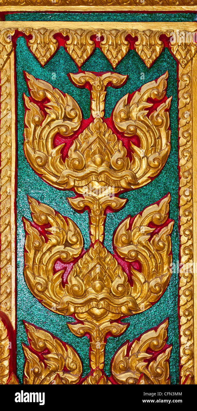 Native art carved on the wall in the temple Stock Photo - Alamy