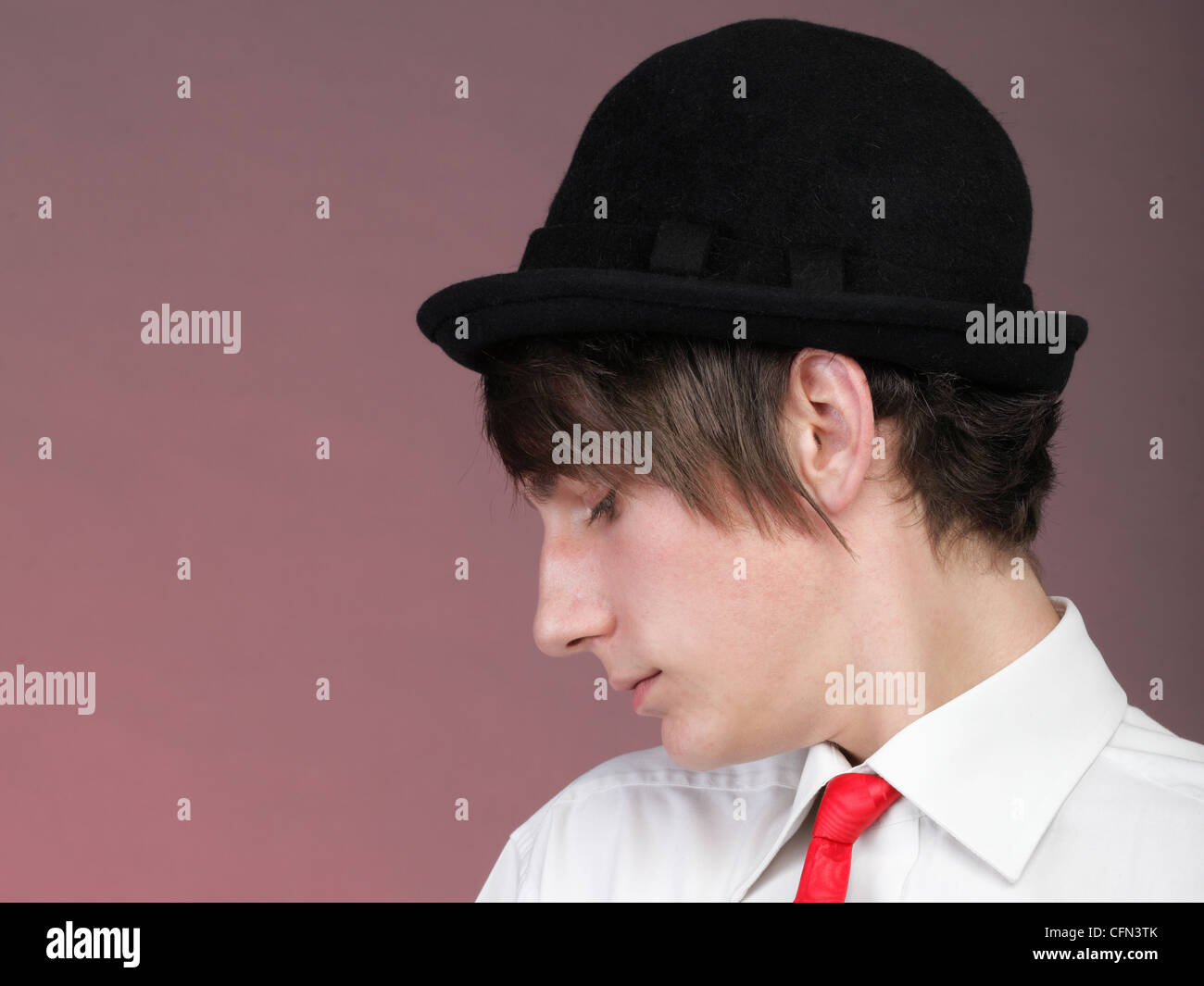 Young men with the red rose on colour background. Love and reflection ...