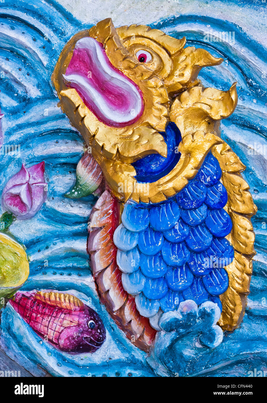 Native art carved on the wall in the temple Stock Photo - Alamy