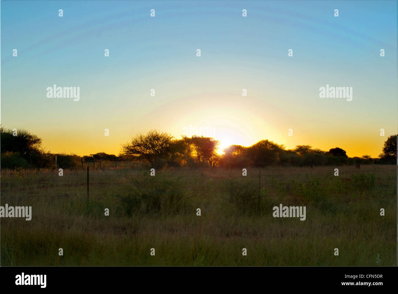 Sunset in Botswana Stock Photo - Alamy