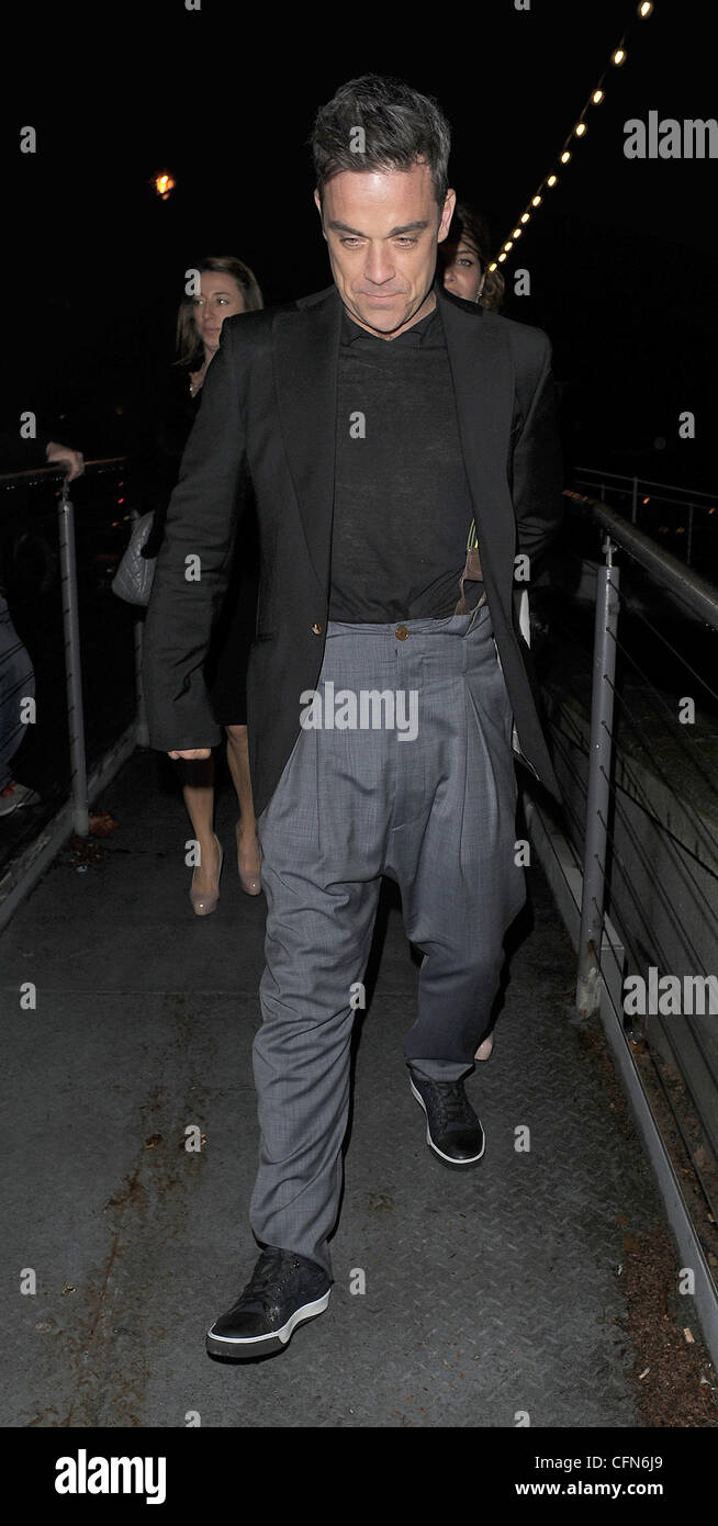 Robbie Williams of 'Take That' arriving at the Savoy Pier. The BRIT ...