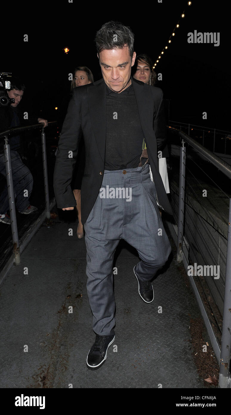 Robbie Williams of 'Take That' arriving at the Savoy Pier. The BRIT ...
