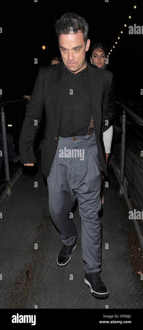 Robbie Williams of 'Take That' arriving at the Savoy Pier. The BRIT ...
