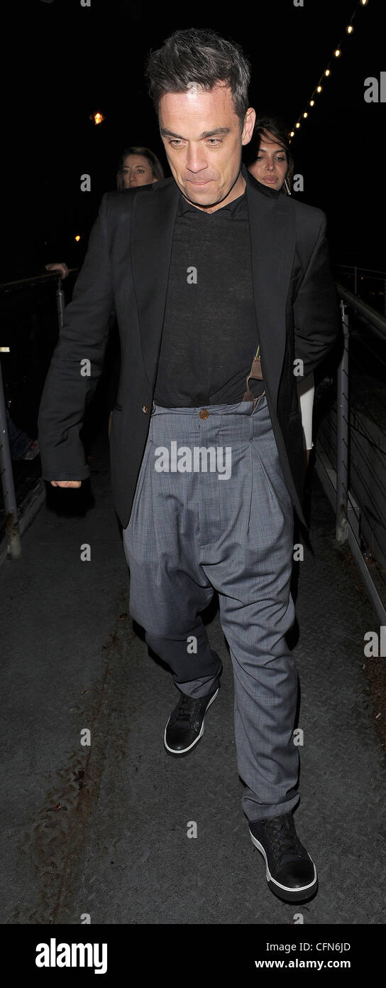 Robbie Williams of 'Take That' arriving at the Savoy Pier. The BRIT ...