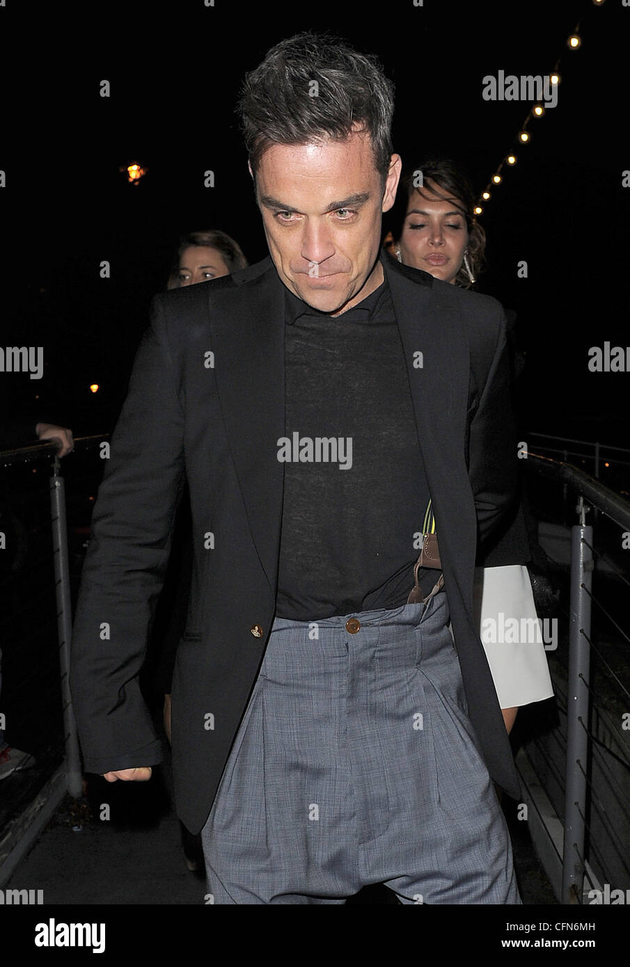 Robbie Williams of 'Take That' arriving at the Savoy Pier. The BRIT ...