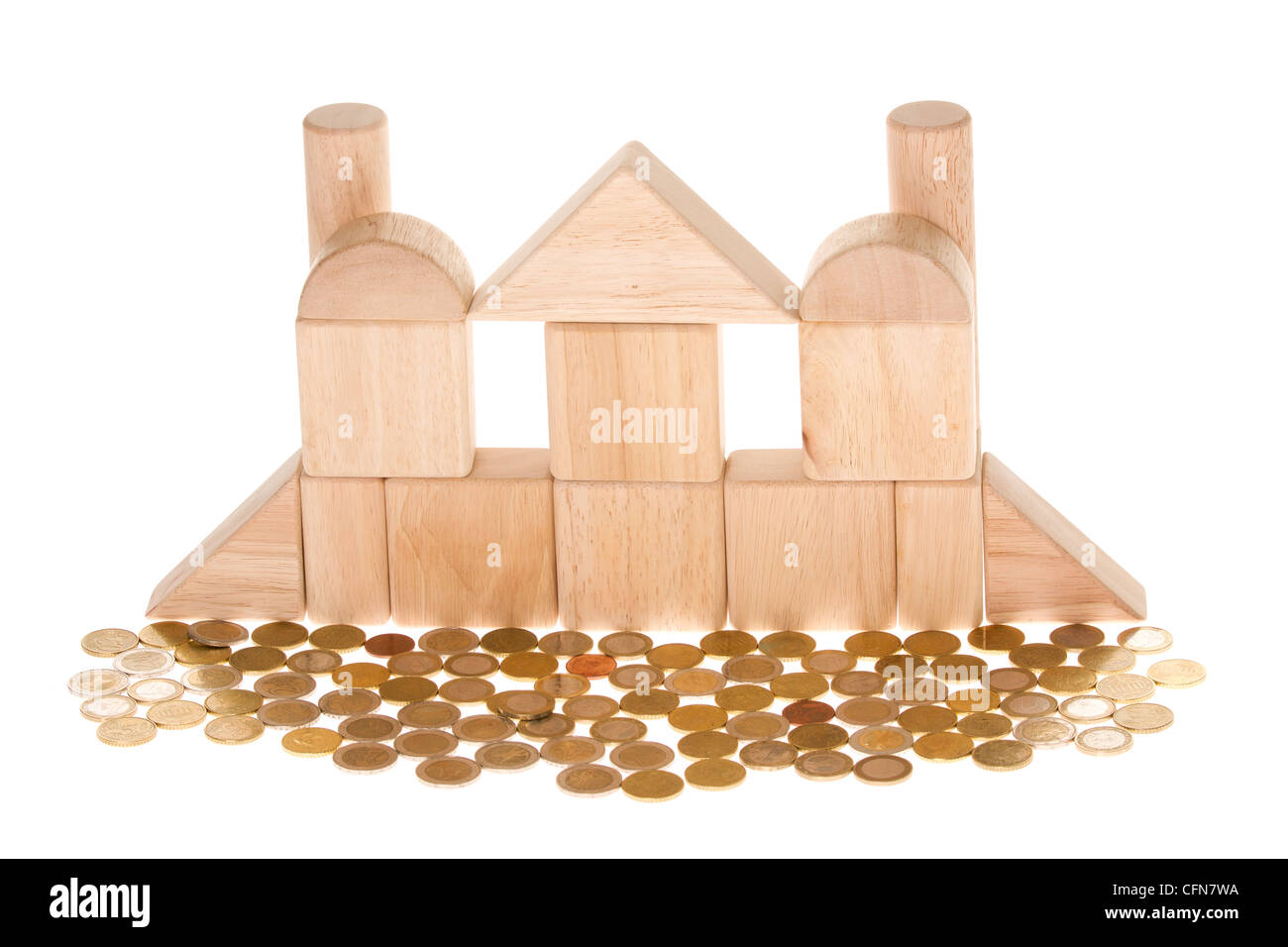 A wooden structure surrounded with coins isolated on white background ...