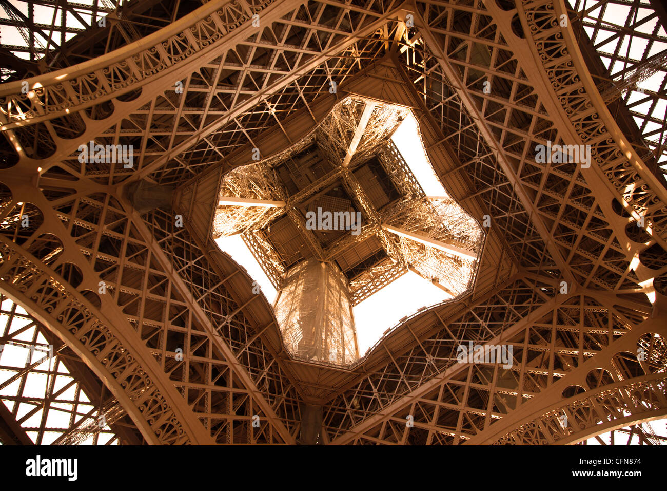 Looking up towards the spire of the Eiffel Tower in Paris at dusk Stock ...