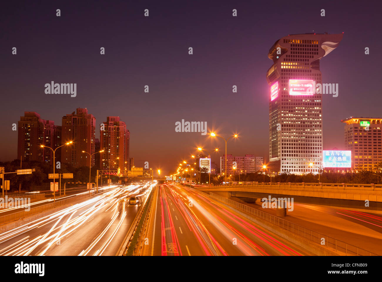 Busy traffic and light trails through city centre, Beijing, China, Asia ...