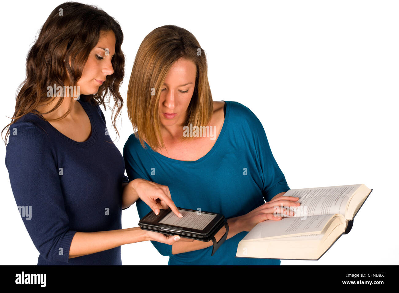Students comparing a paper and an electronic book Stock Photo - Alamy