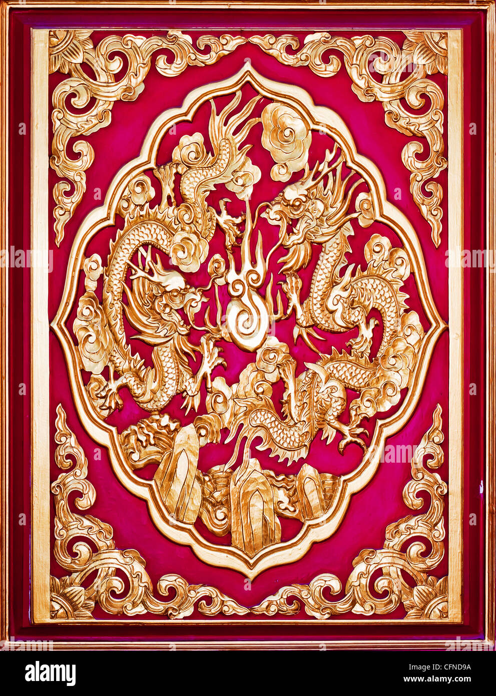 Dragon, Native art carved on the wall in the temple Stock Photo - Alamy