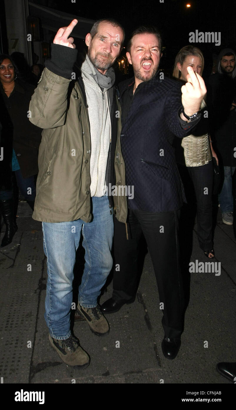 Ricky Gervais jokes around with a homeless man outside Automat ...