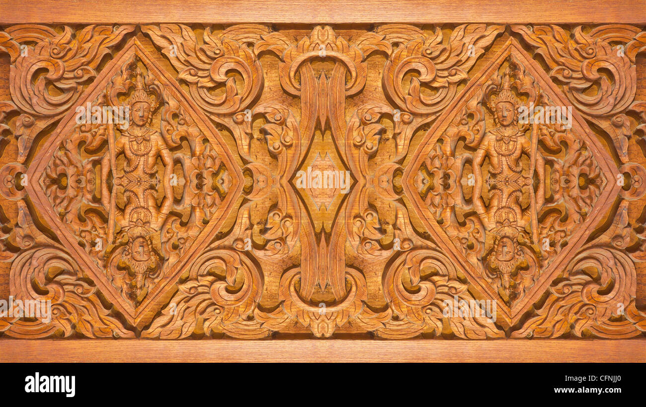 Native art carved on the wall in the temple Stock Photo - Alamy