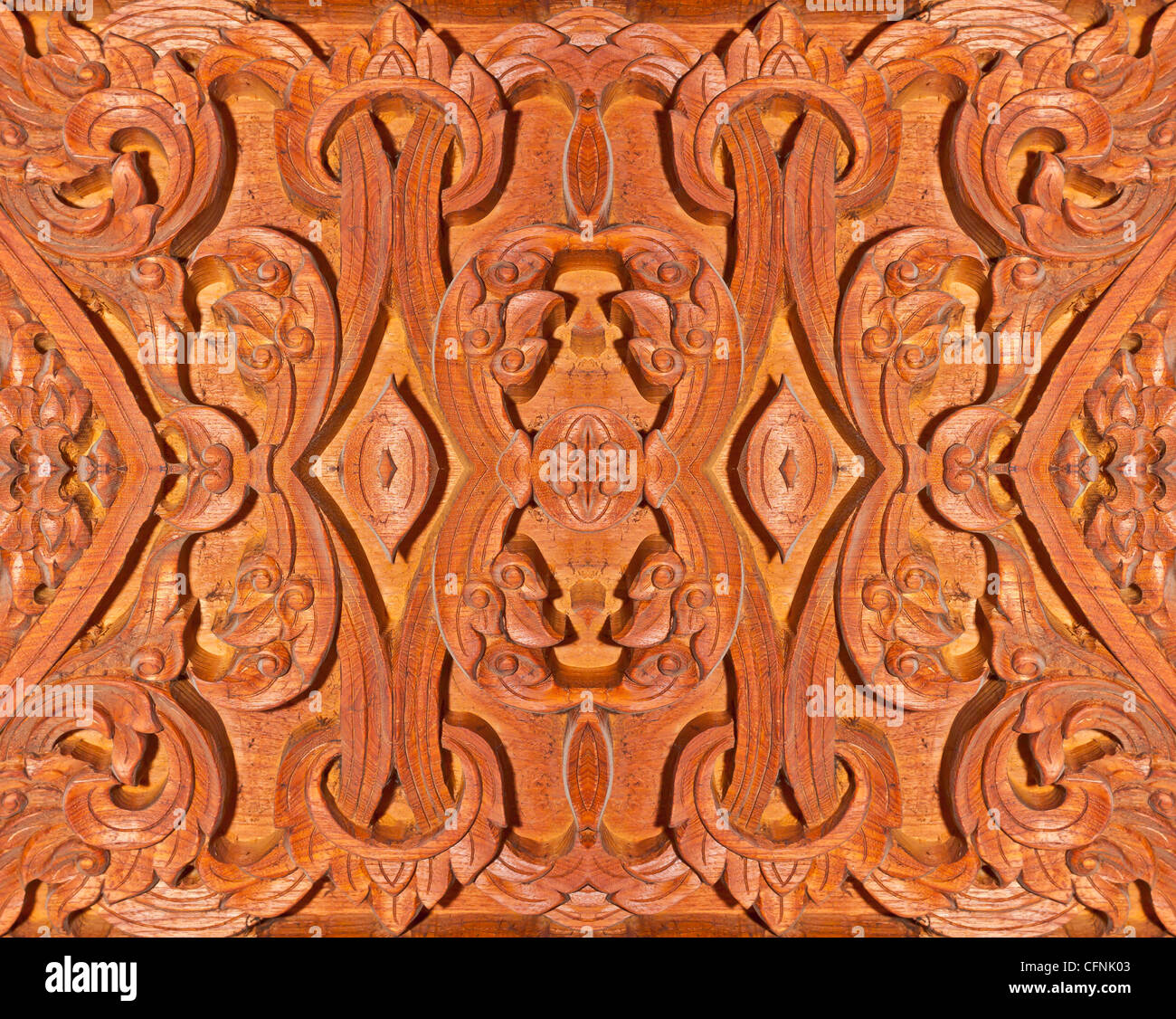 Native art carved on the wall in the temple Stock Photo - Alamy
