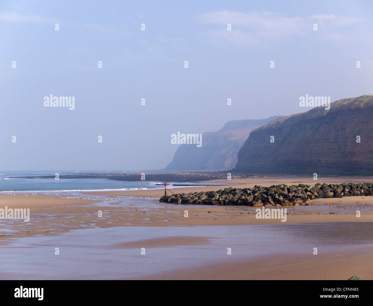 The entrance to the little harbour at Skinningrove with spring sun ...