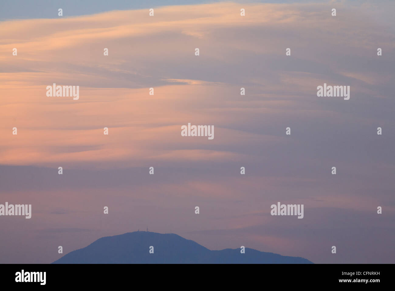 Lenticular cloud formation (Altocumulus lenticularis) at sunrise over ...